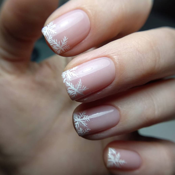 A full set of 24 short square fake nails designed with a light pink ...