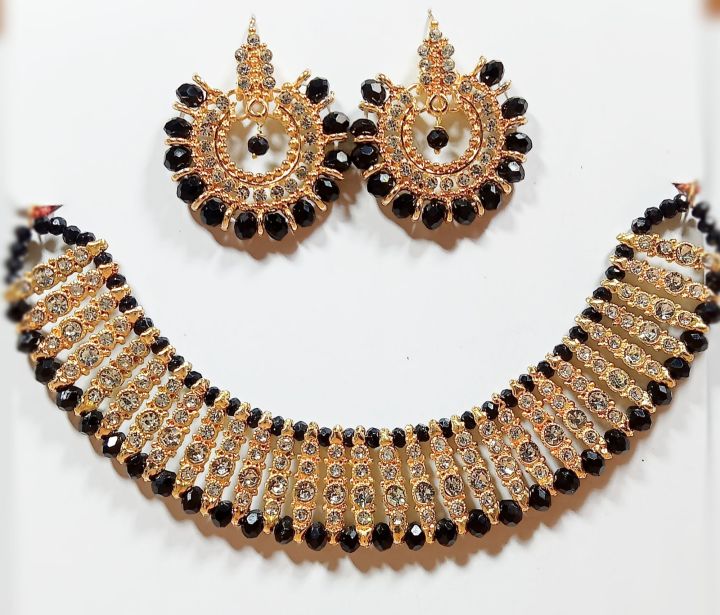 Black colour artificial jewellery set of round crystal earrings and ...