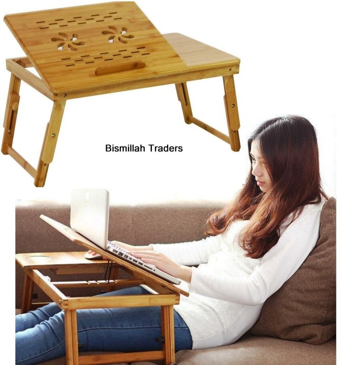 Laptop bed table with cooling fan store