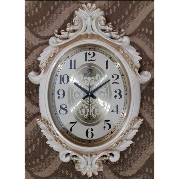 BEAUTIFUL ELEGANT CLASSY OVAL DESIGN WALL CLOCK UNIQUE DESIGN ON TOP ...