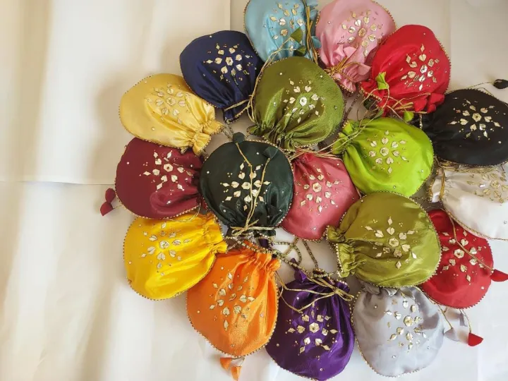 Fancy embroidered clutch/potli bag for wedding parties designer ...